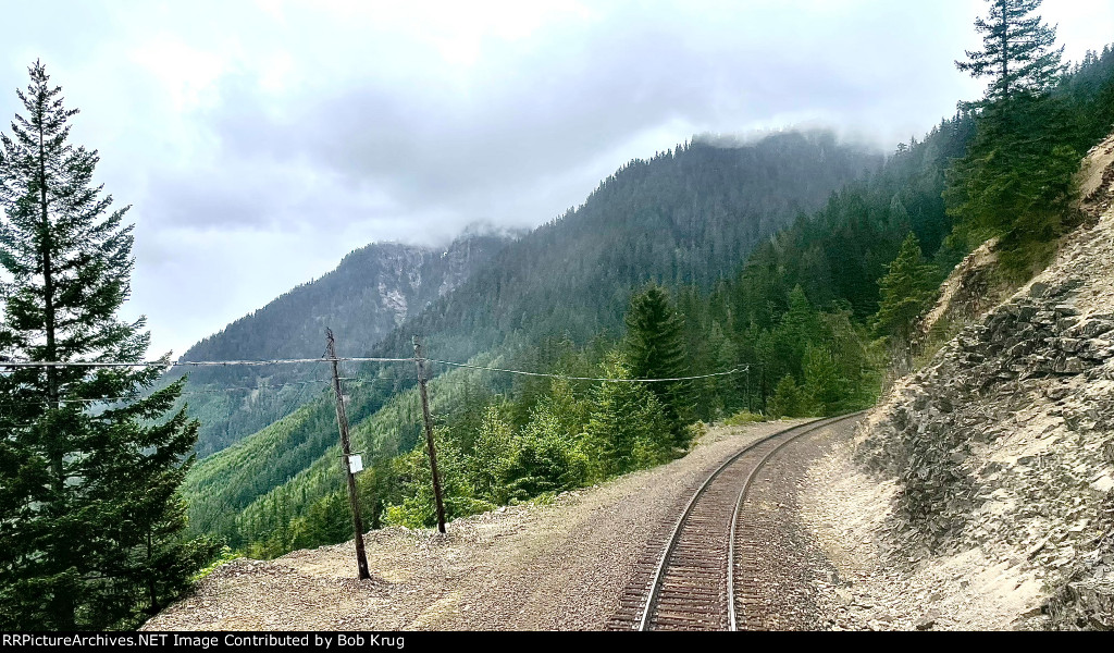 View out the rear car on the northbound Coast Starlgiht while descending Pengra Pass on UP's ...